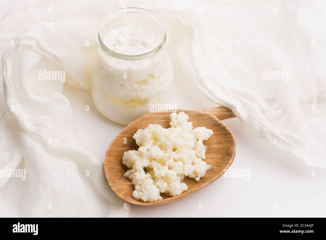 Milk kefir grains in spoon. Yeast bacterial fermentation starter Stock ...