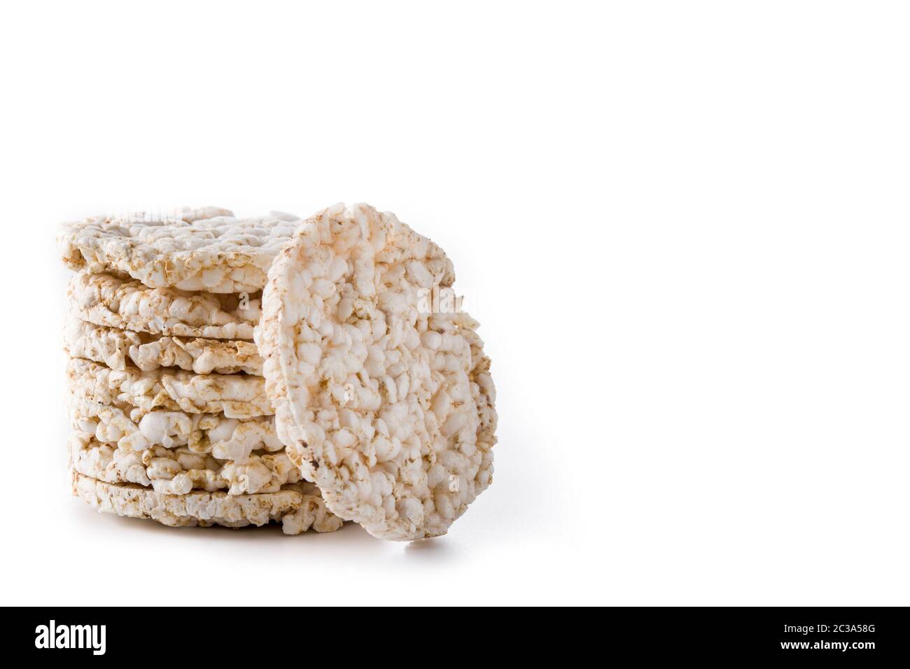 Pile of puffed rice cakes isolated on white background Stock Photo - Alamy