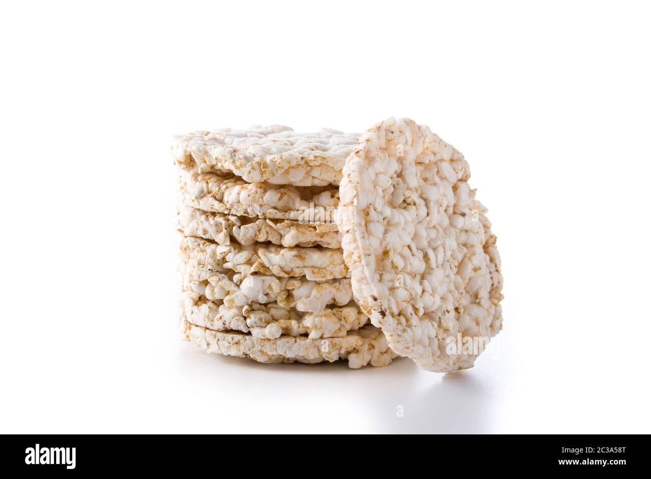 Pile of puffed rice cakes isolated on white background Stock Photo - Alamy