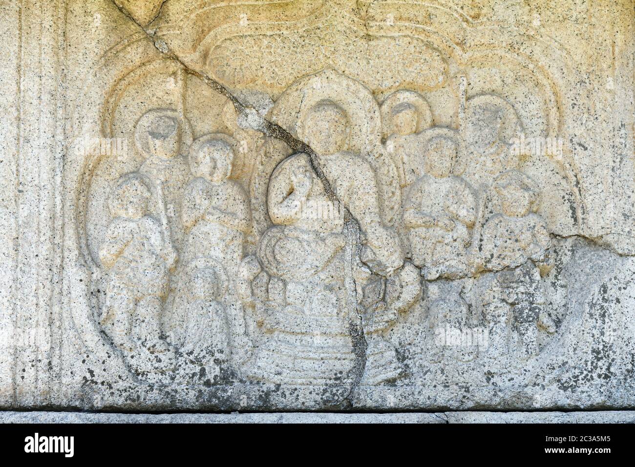 Traditional Korean stone carving, buddhist monks on an ancient stone ...