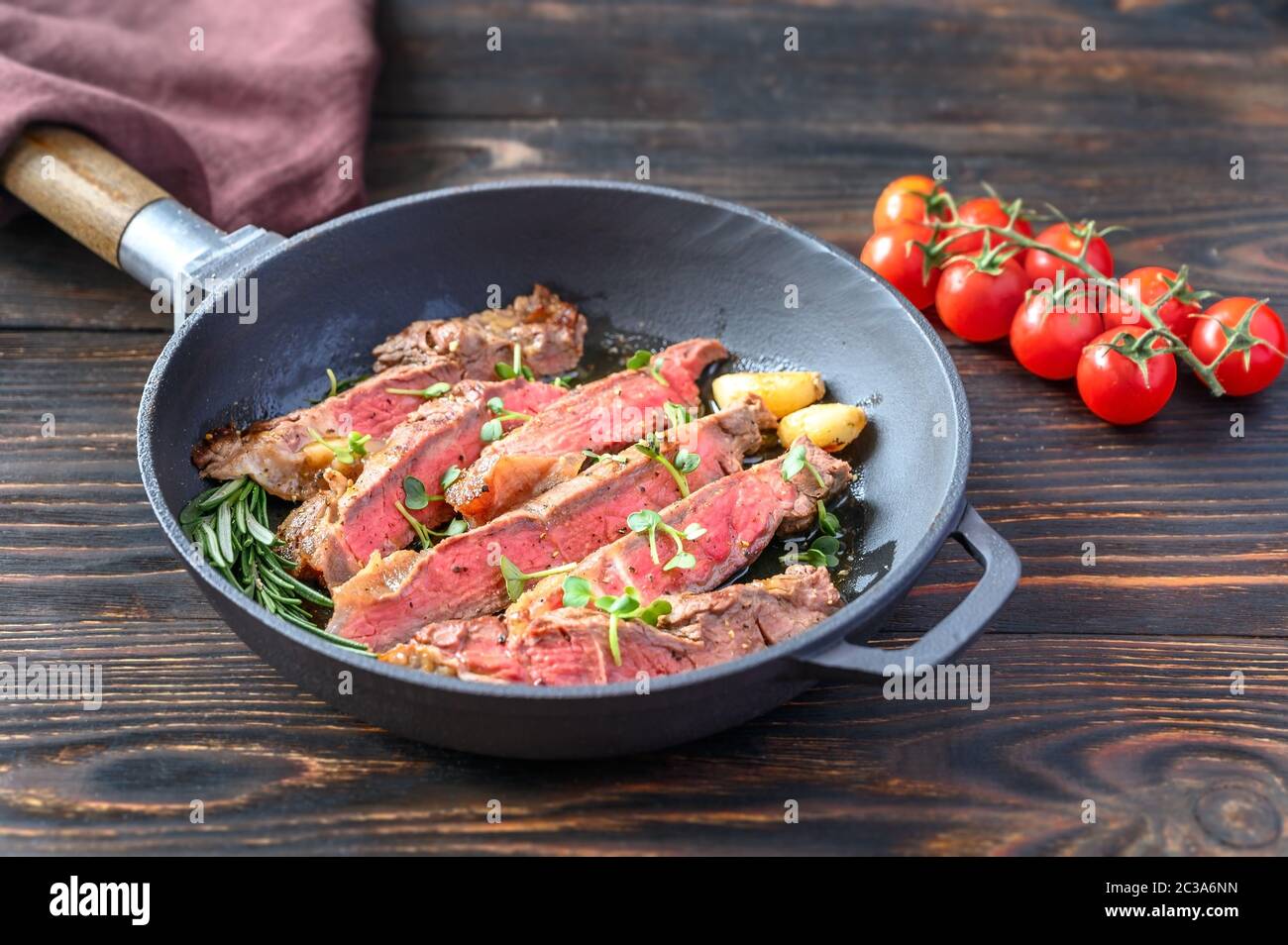 Cut beef steak in the frying pan Stock Photo - Alamy