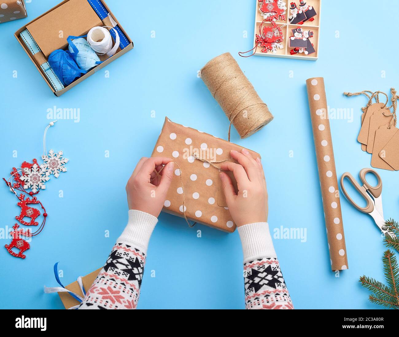 gift wrapped in pink paper and tied with a brown rope, empty tag for ...