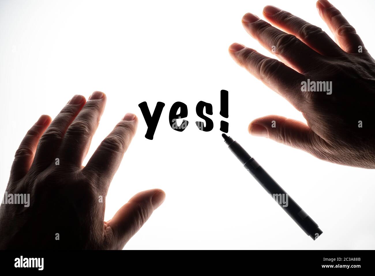 the word Yes written on a backlit surface Stock Photo - Alamy