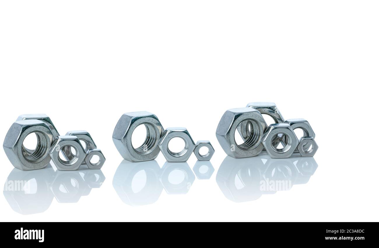 Set of metal hexagon nuts isolated on white background. Small, medium ...