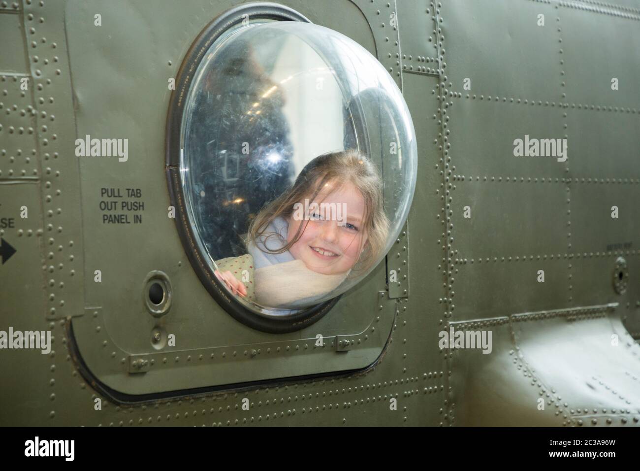 Visitor tourist / children / child / girl looks out of plexi glass ...