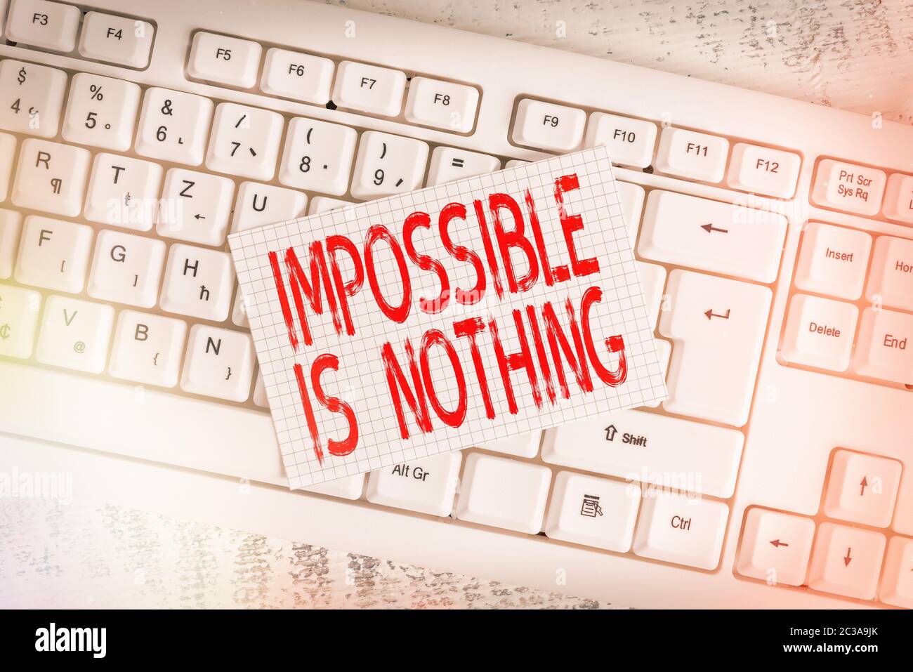 Writing note showing Impossible Is Nothing. Business concept for ...