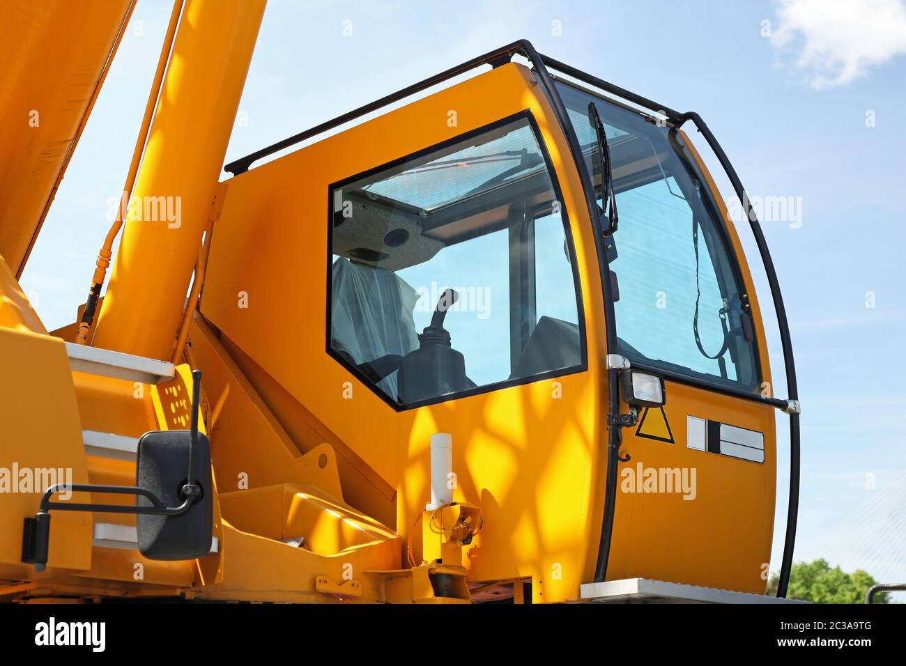Yellow safety cabin for construction crane operator Stock Photo - Alamy