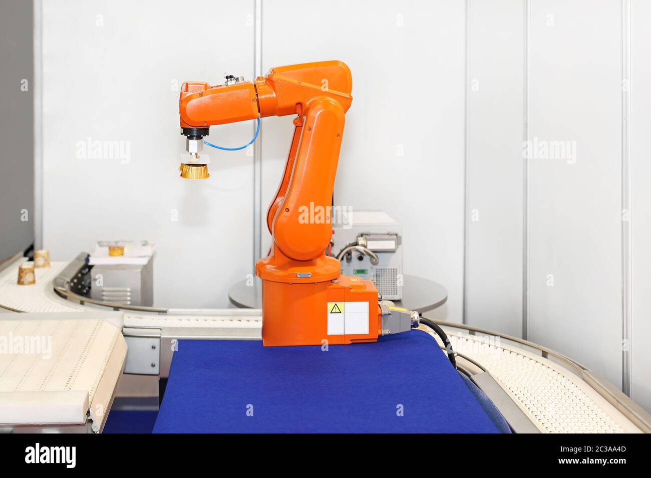 Robotic arm at automated factory production line Stock Photo - Alamy
