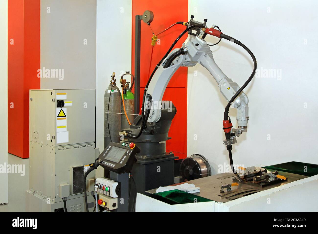 Production line with automatic plasma welding robot Stock Photo - Alamy