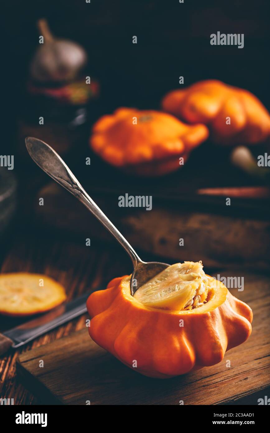 Preparing yellow pattypan squash for stuffing with minced meat Stock ...