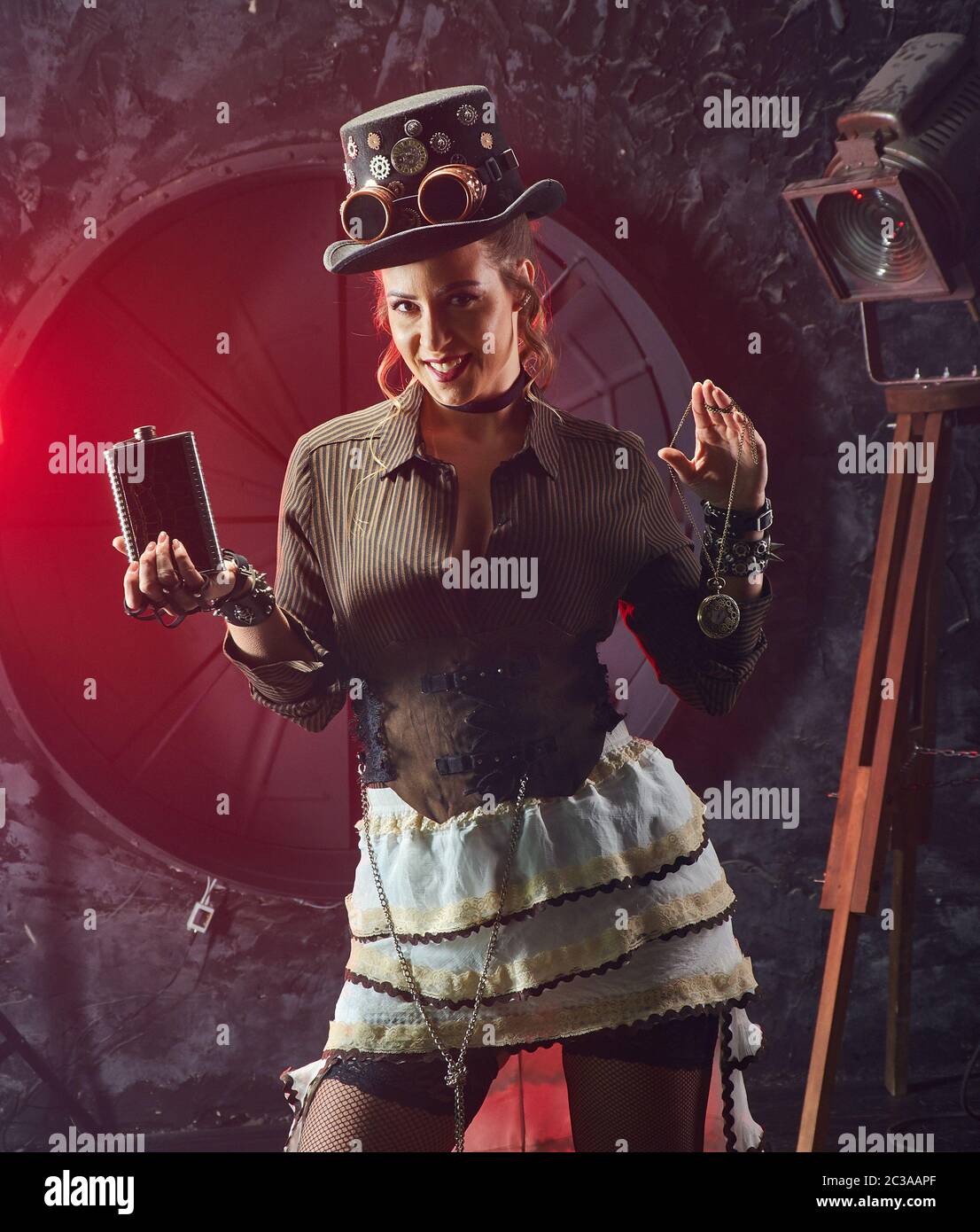 Portrait of a beautiful steampunk girl with watch and flask Stock Photo ...