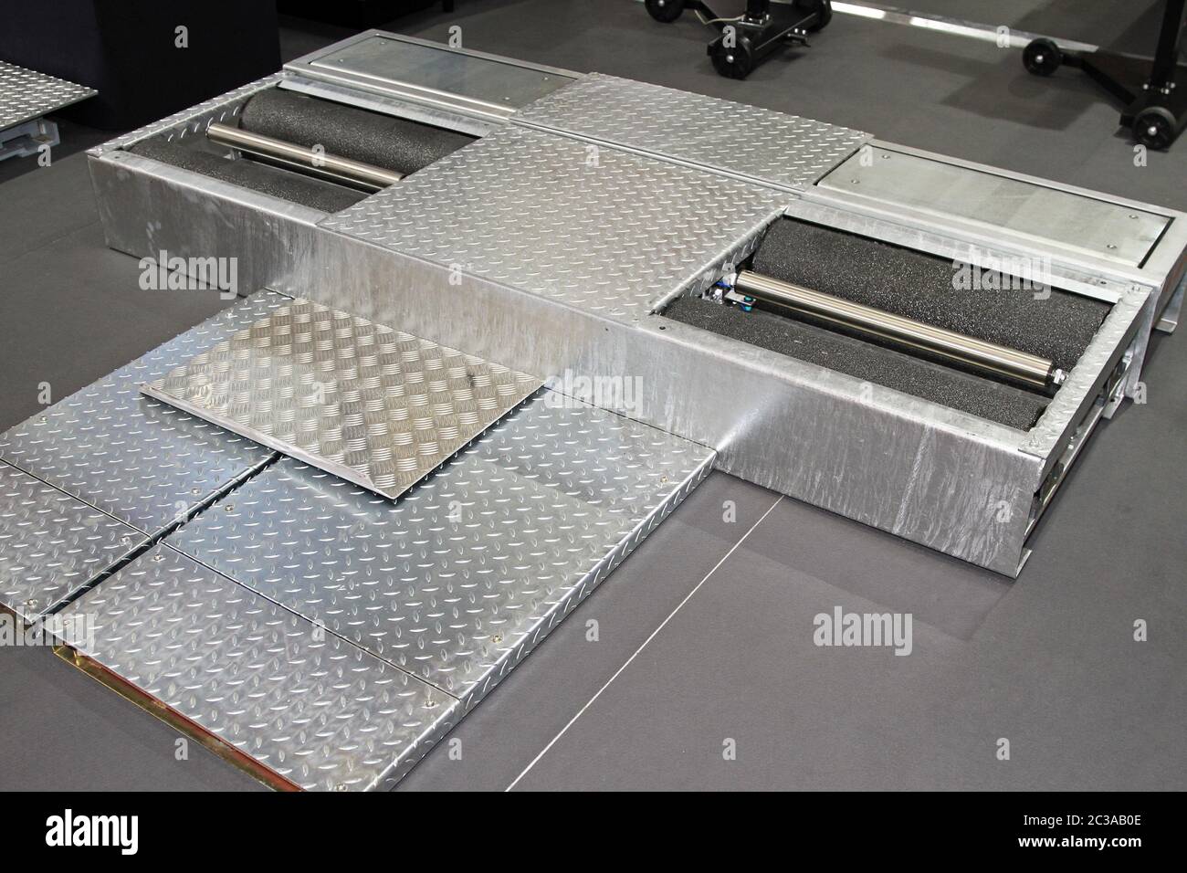 Brake test equipment with rollers in garage Stock Photo - Alamy