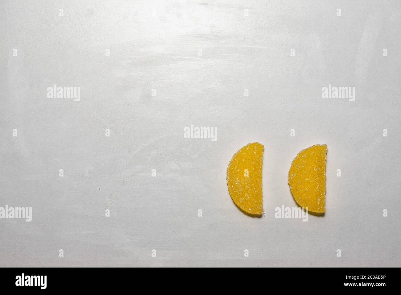 Two Sugar candies shaped as half moon Stock Photo - Alamy