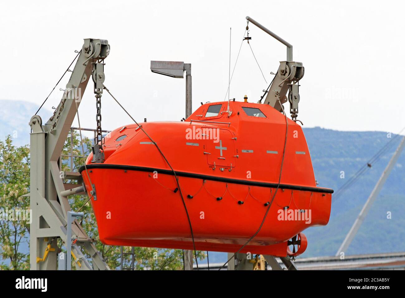 Bright orange emergency escape safety boat for oil tankers Stock Photo ...