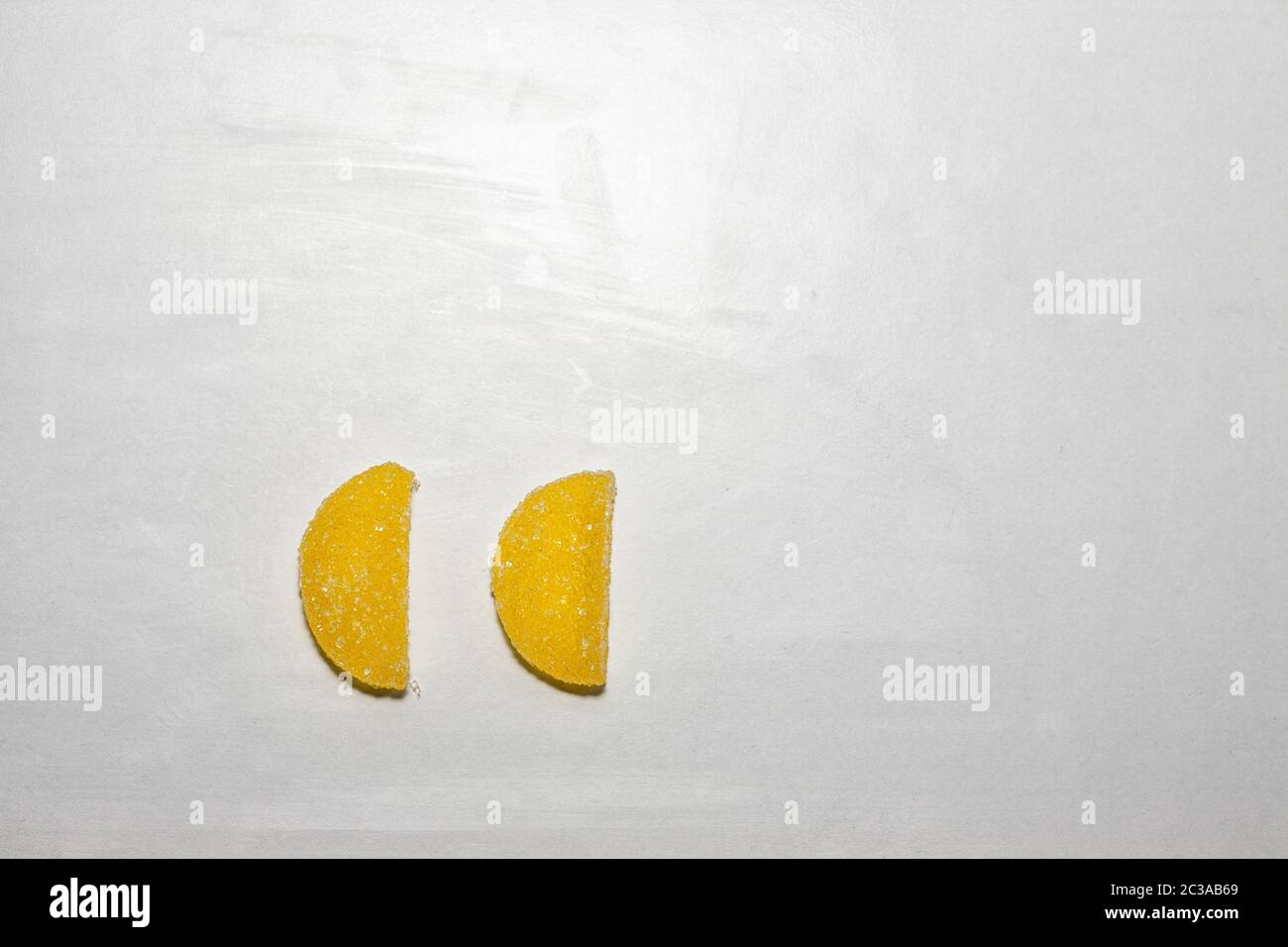 Two Sugar candies shaped as half moon Stock Photo - Alamy