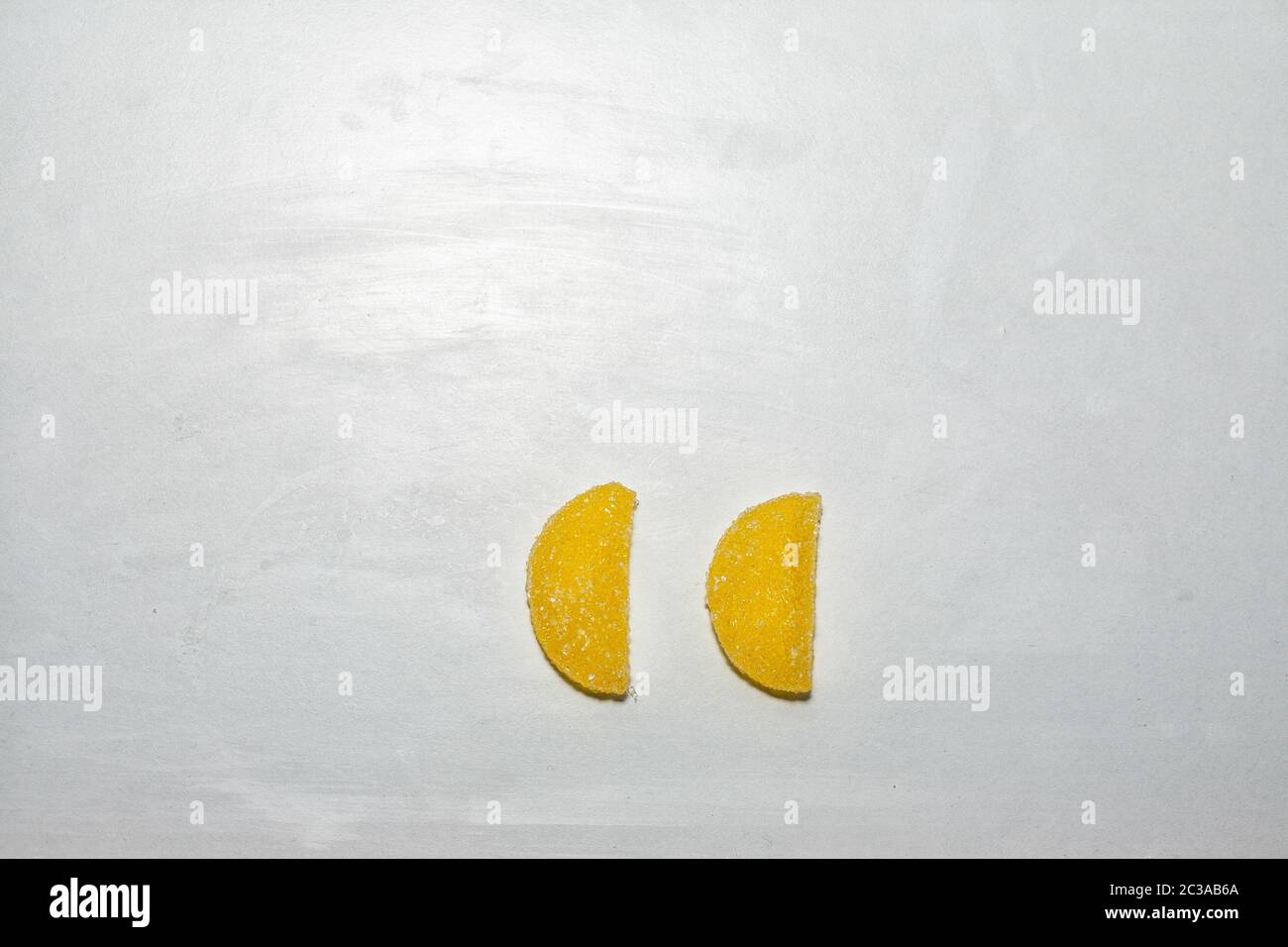 Two Sugar candies shaped as half moon Stock Photo - Alamy