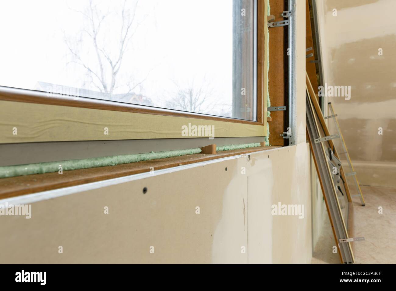 PVC window instalation in a new insulated and filled dry wall attic ...