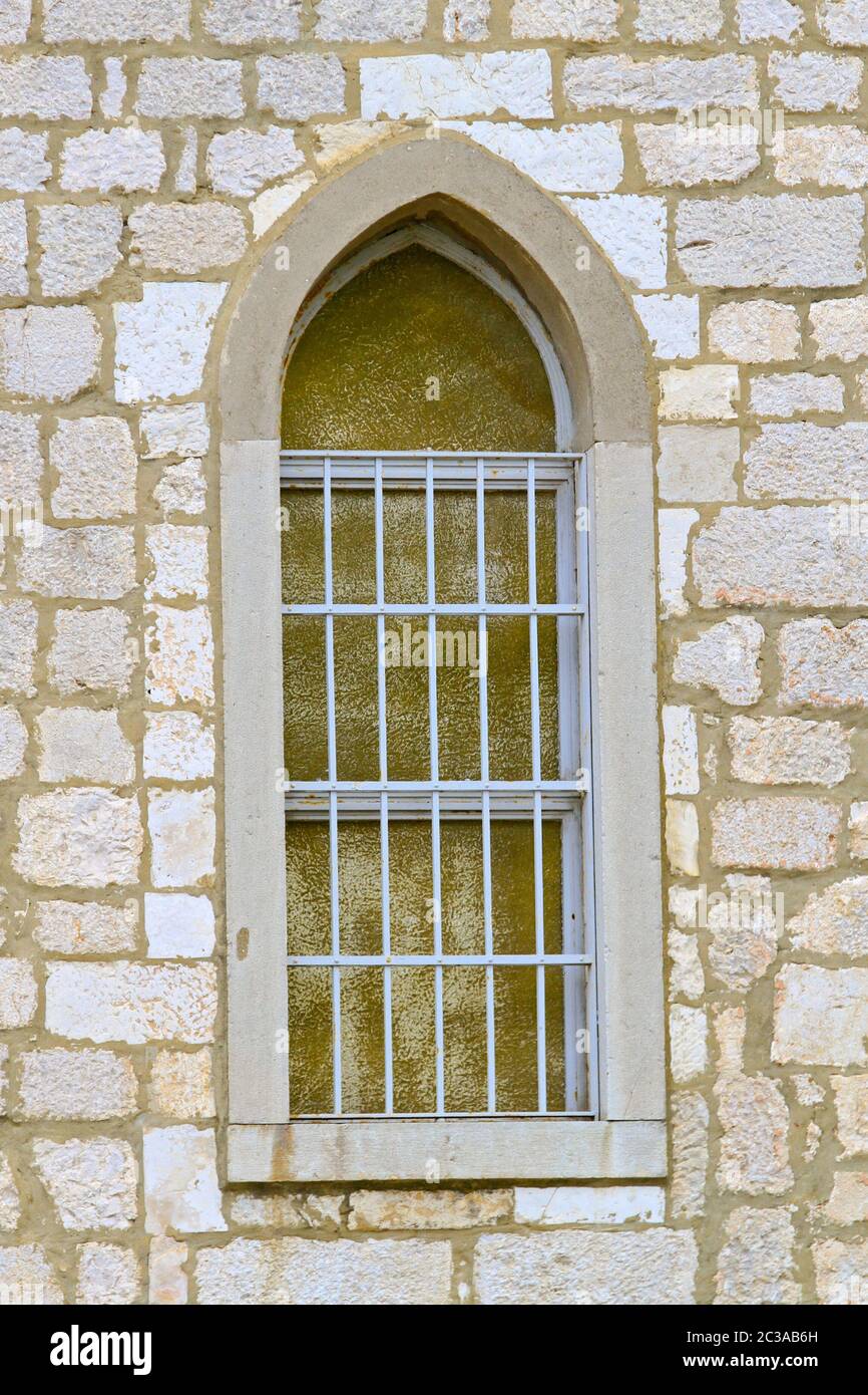 Gothic style window with security metal bars Stock Photo - Alamy