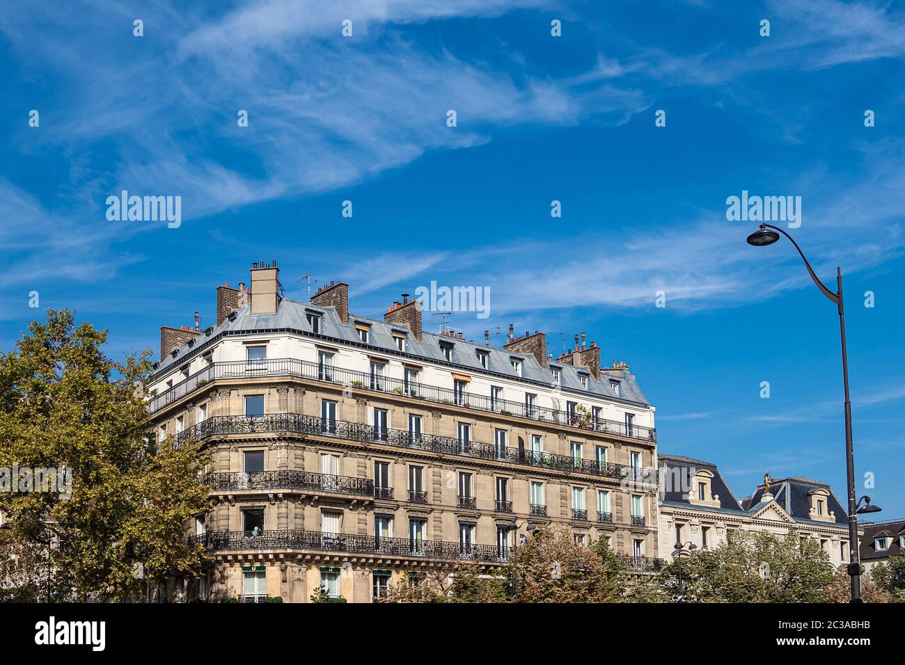 View to a building with trees in Paris, France Stock Photo - Alamy