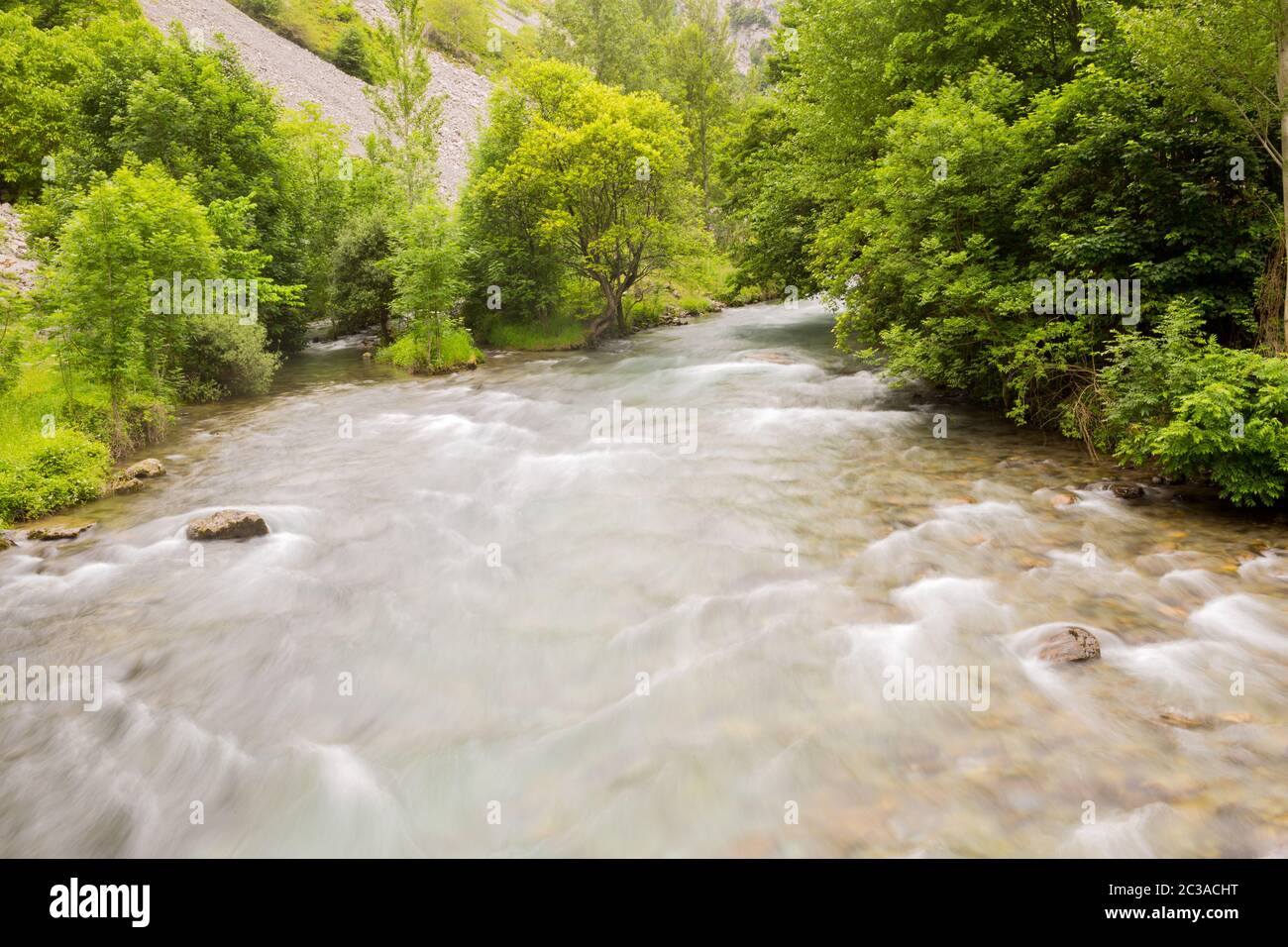 Waterfall in the Cares River located in the Picos de Europa National ...