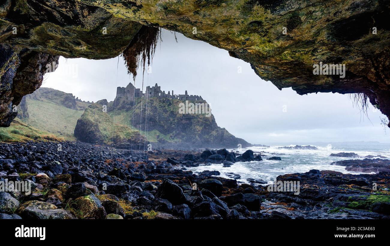 Ruined medieval Dunluce Castle on the cliff in Bushmills, Northern ...