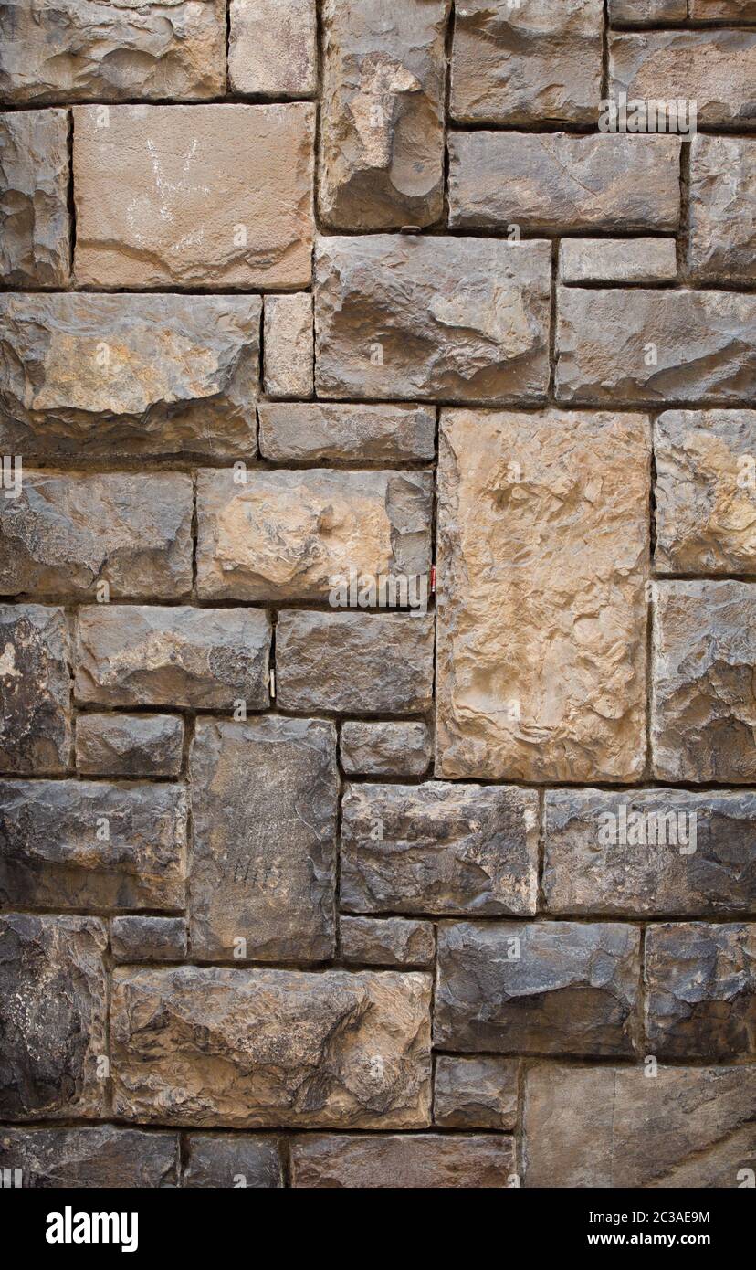 Ancient brick stone wall. Antique brickwork with stones of different ...