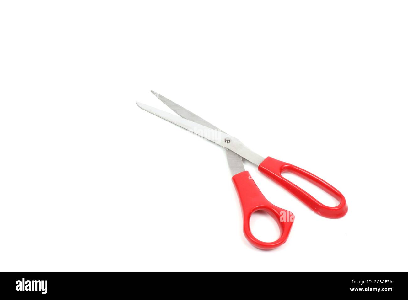 Scissors with red handles over white Stock Photo - Alamy