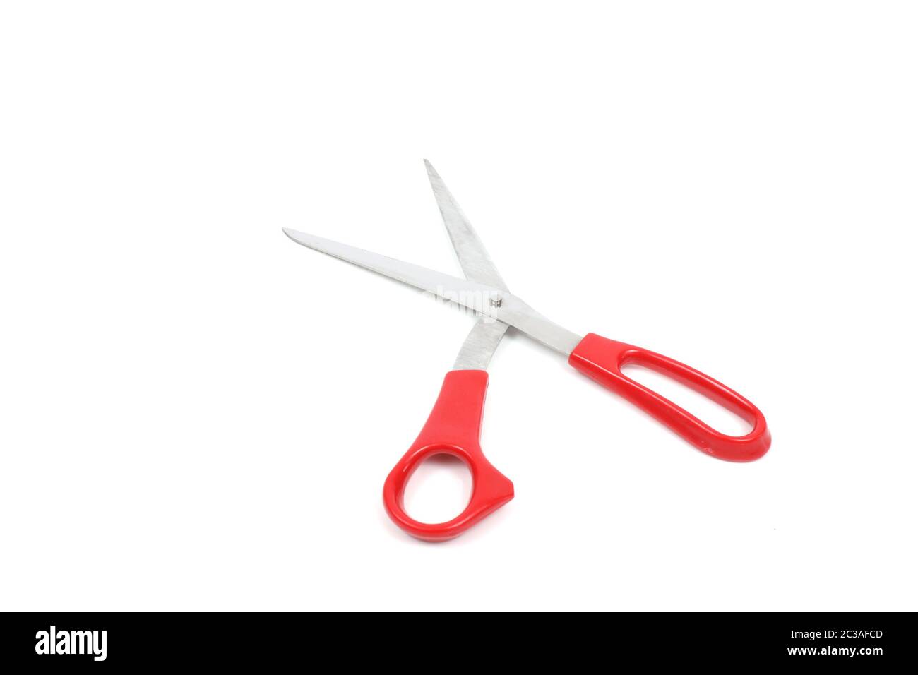 Scissors with red handles over white Stock Photo - Alamy