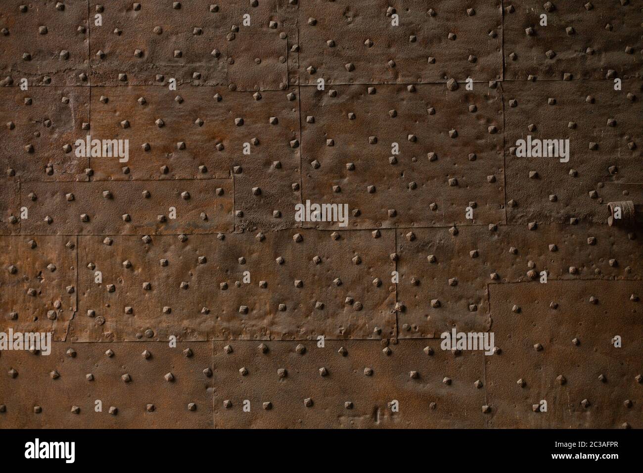 Grunge metal wall with rivets. Rusty metal or iron texture or ...