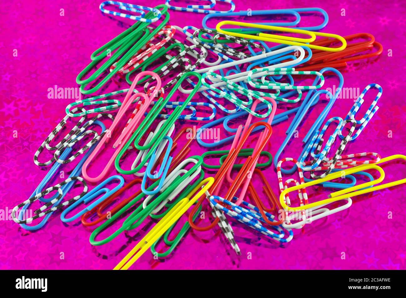 Color clips on abstract background Stock Photo - Alamy
