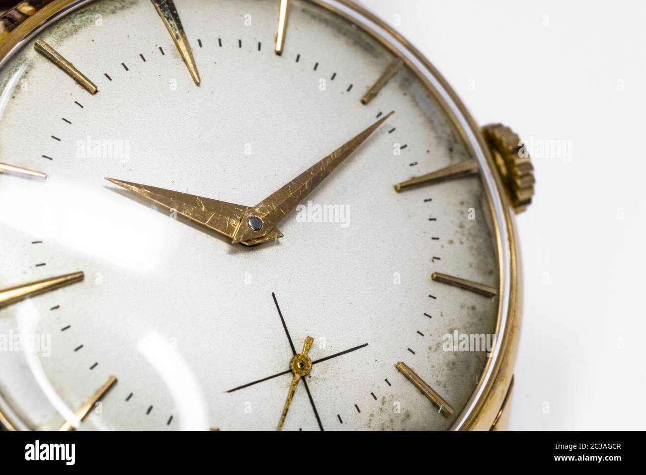 An old gold mechanical wristwatch with manual winding. Antique watch ...