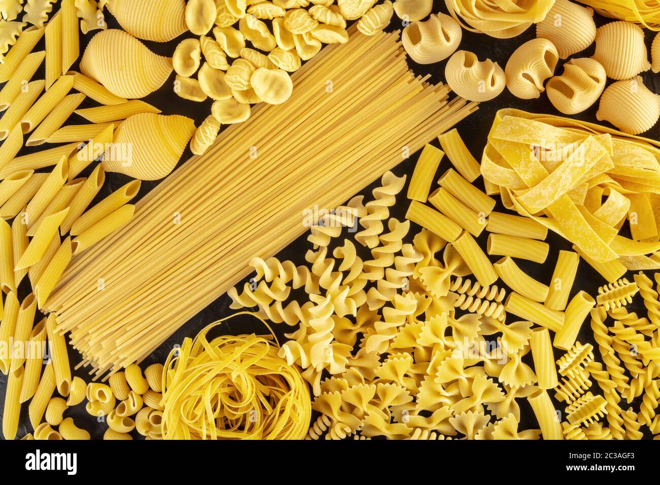 Pasta background texture, a flat lay of many different pasta types ...