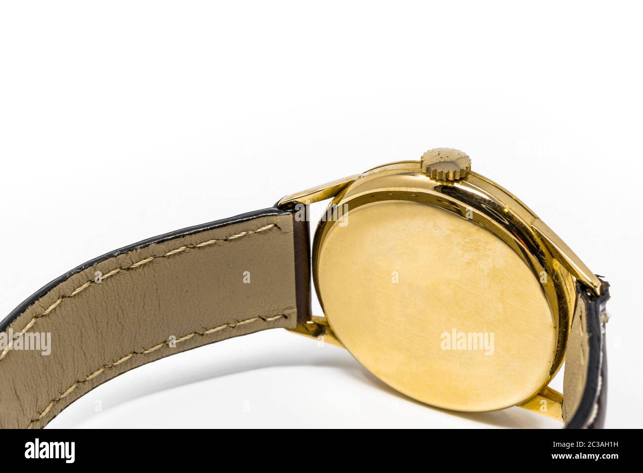 An old gold mechanical wristwatch with manual winding. Antique watch ...