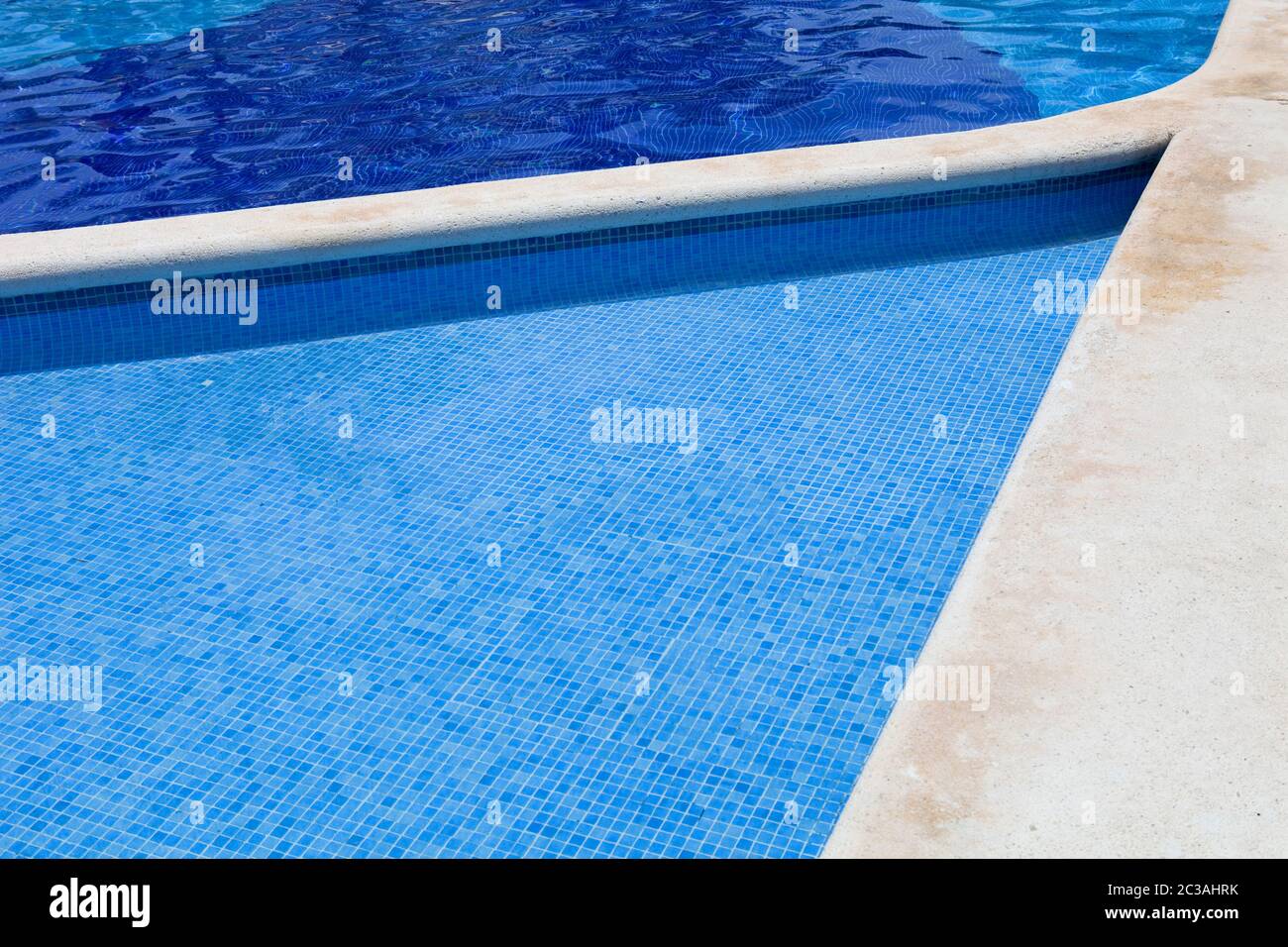 swimming pool blue water detail in summer time Stock Photo - Alamy