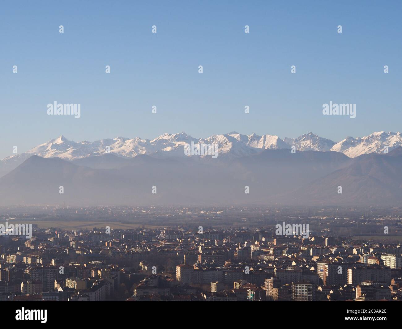 Aerial view of the city of Turin, Italy with Alps mountain range in the ...