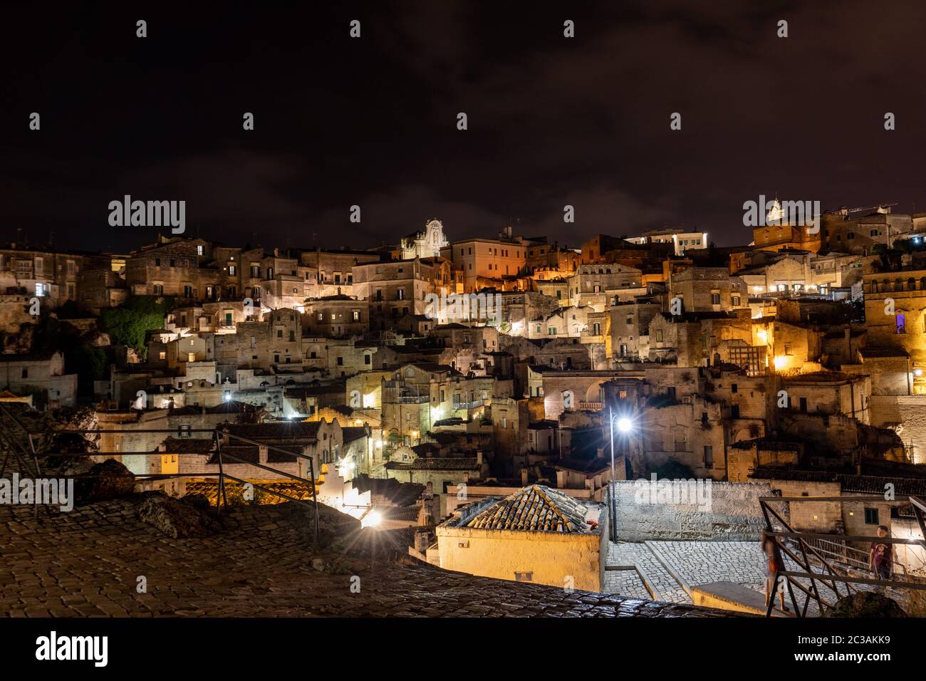 Amazing lighted buildings in ancient Sassi district by night in Matera ...