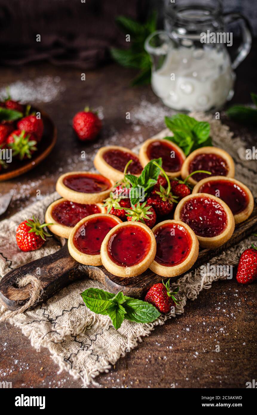 Delicious crispy tartlets with fresh strowberries jam and mint Stock ...