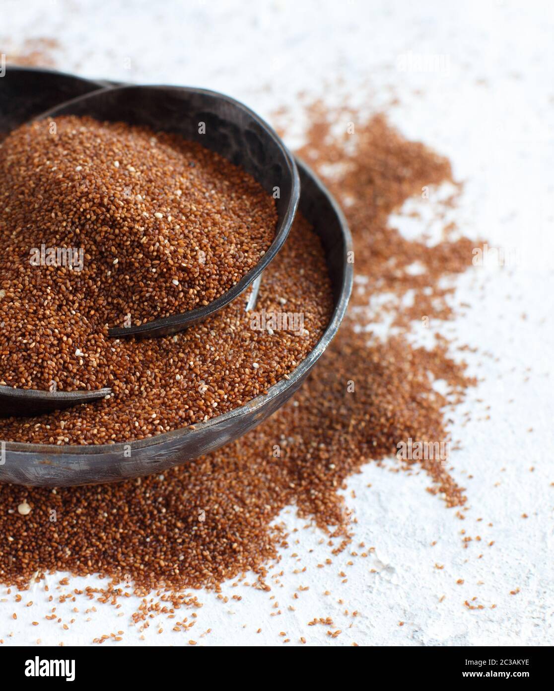 Uncooked teff grain in a bowl close up Stock Photo - Alamy
