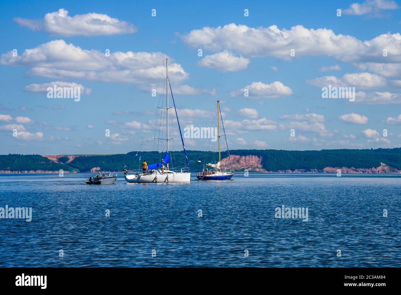 Two Sailing Boats and One Motor Boat on the River Stock Photo - Alamy