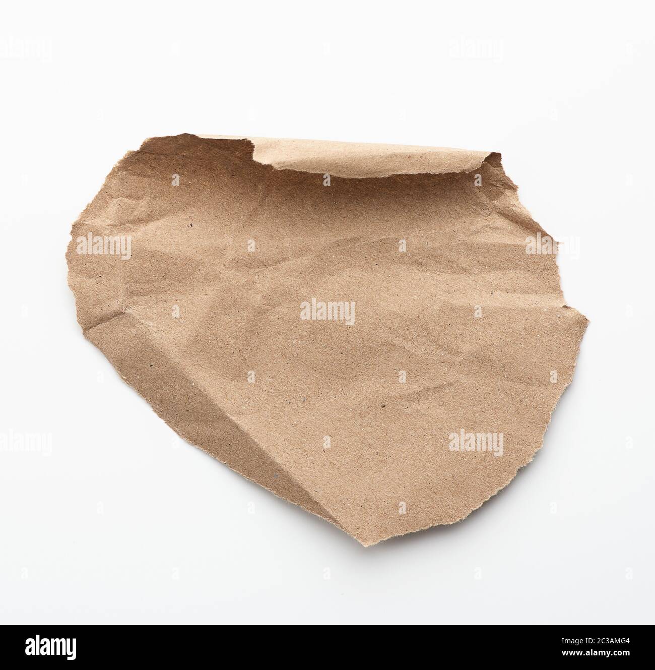 round piece of brown paper paper with torn edges on a white background ...