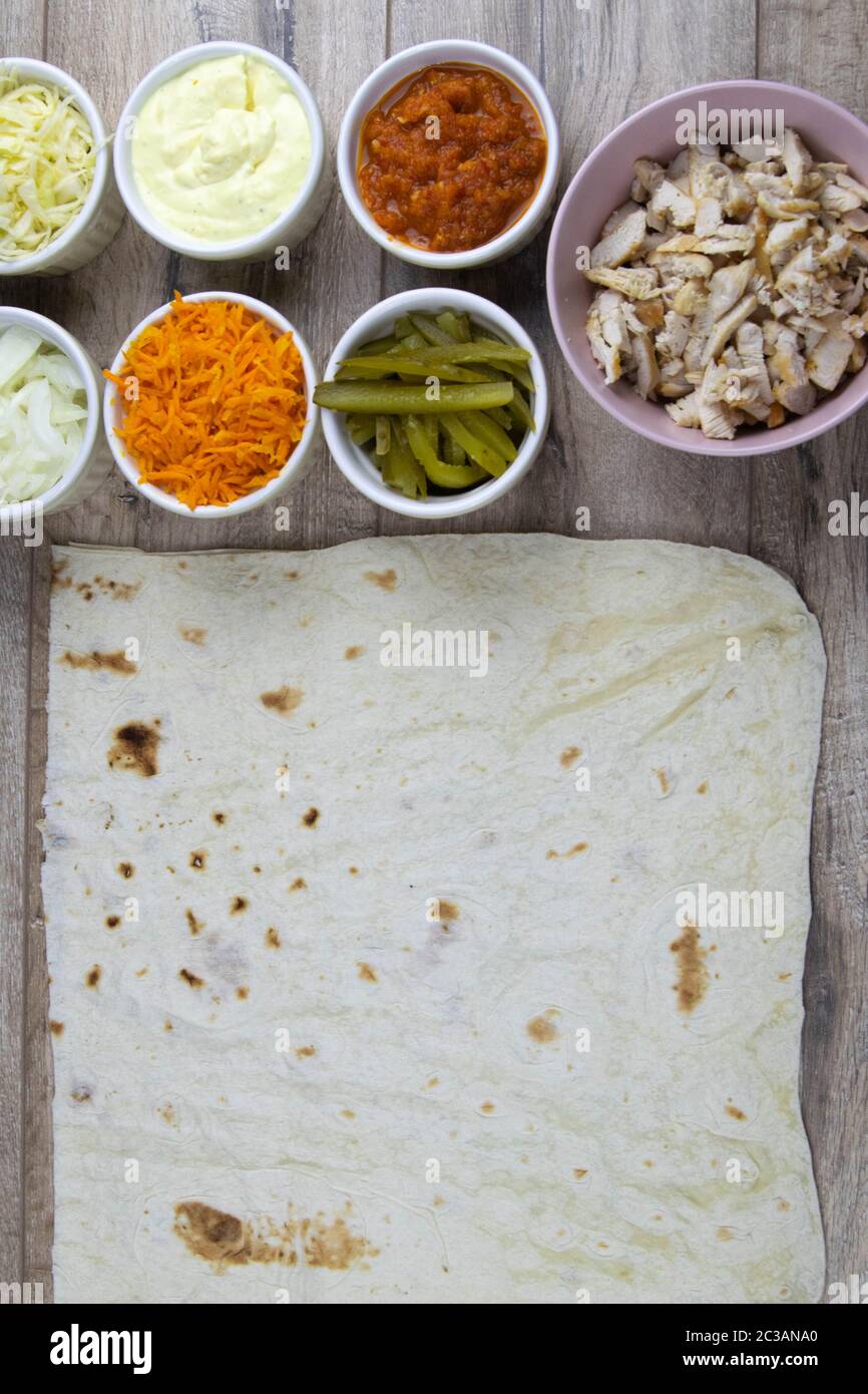 Preparation for the preparation of chicken shawarma with ingredients ...