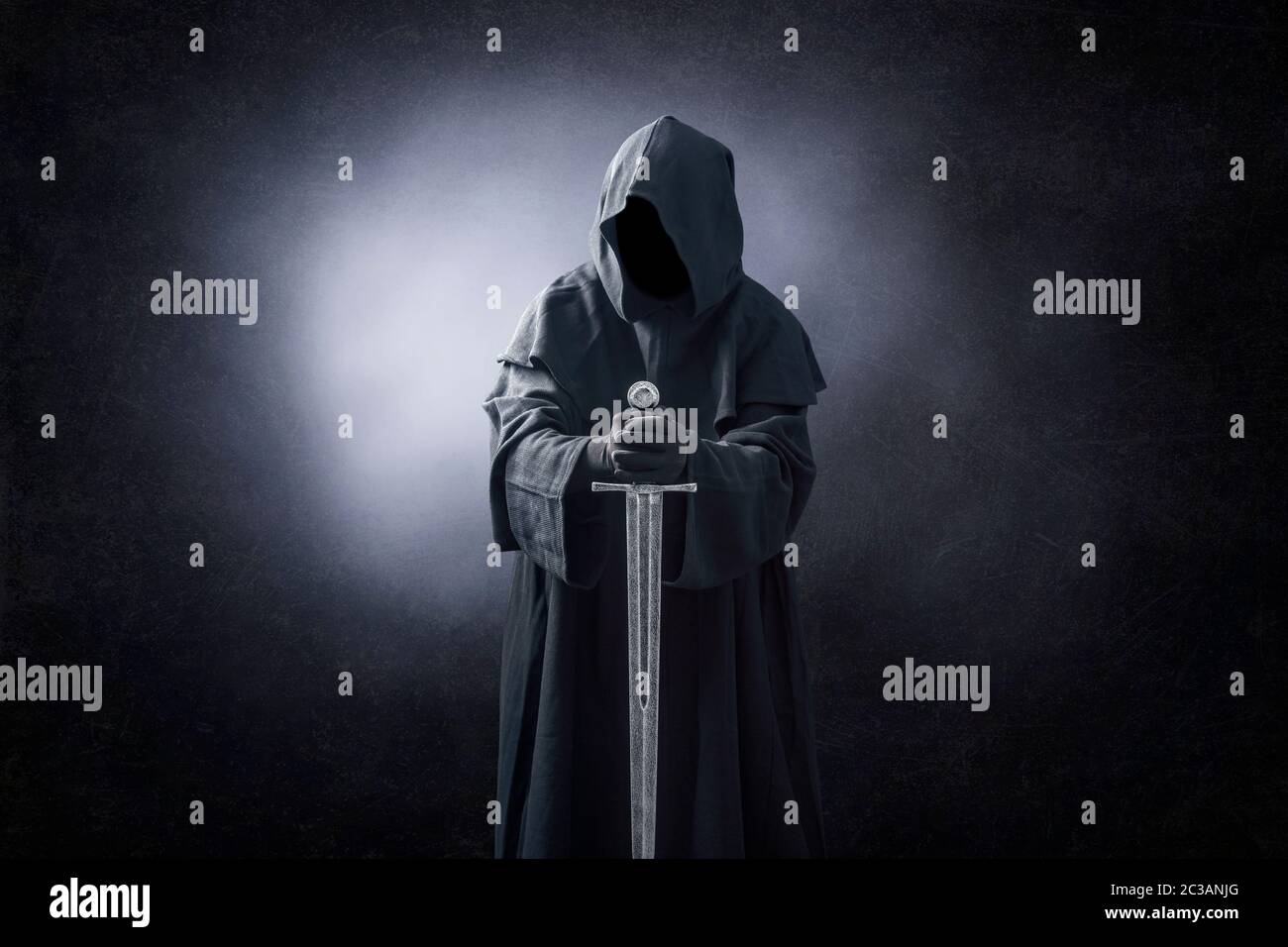 Ghostly figure with medieval sword in the dark Stock Photo - Alamy