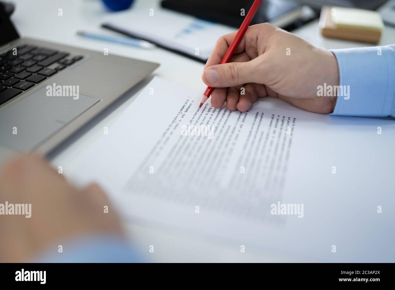 Close-up Of Red Pencil Marking Error During Spellchecking Text On Paper ...