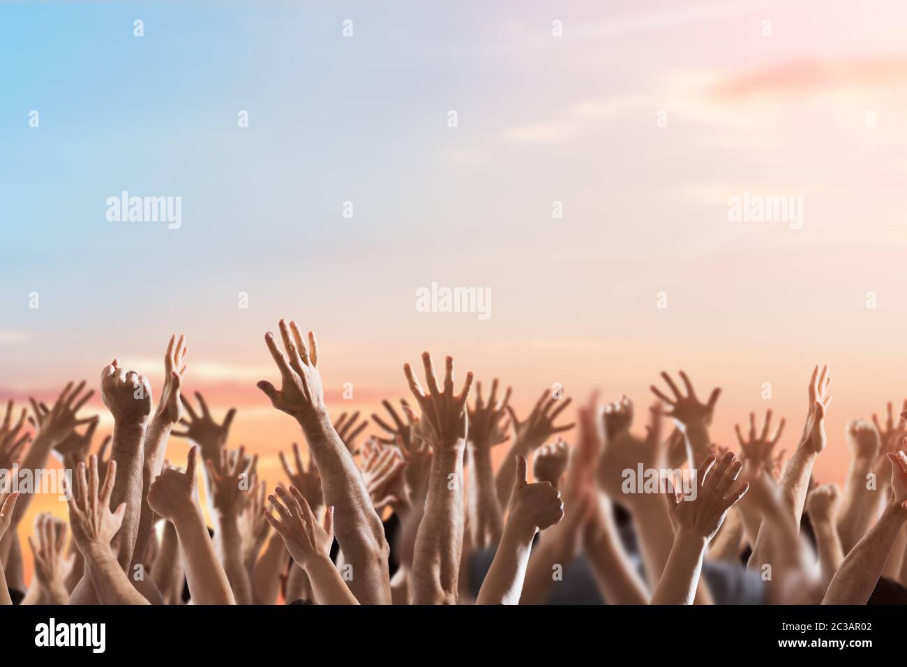 Crowd Of People Raising Hands At Celebration Event Stock Photo - Alamy