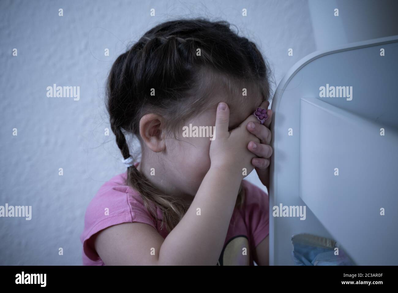 Little Girl Crying. Very Sad Girl Covering Her Eyes Stock Photo - Alamy