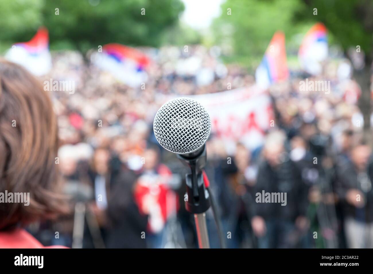 Protest. Public demonstration. Microphone in focus against blurred ...