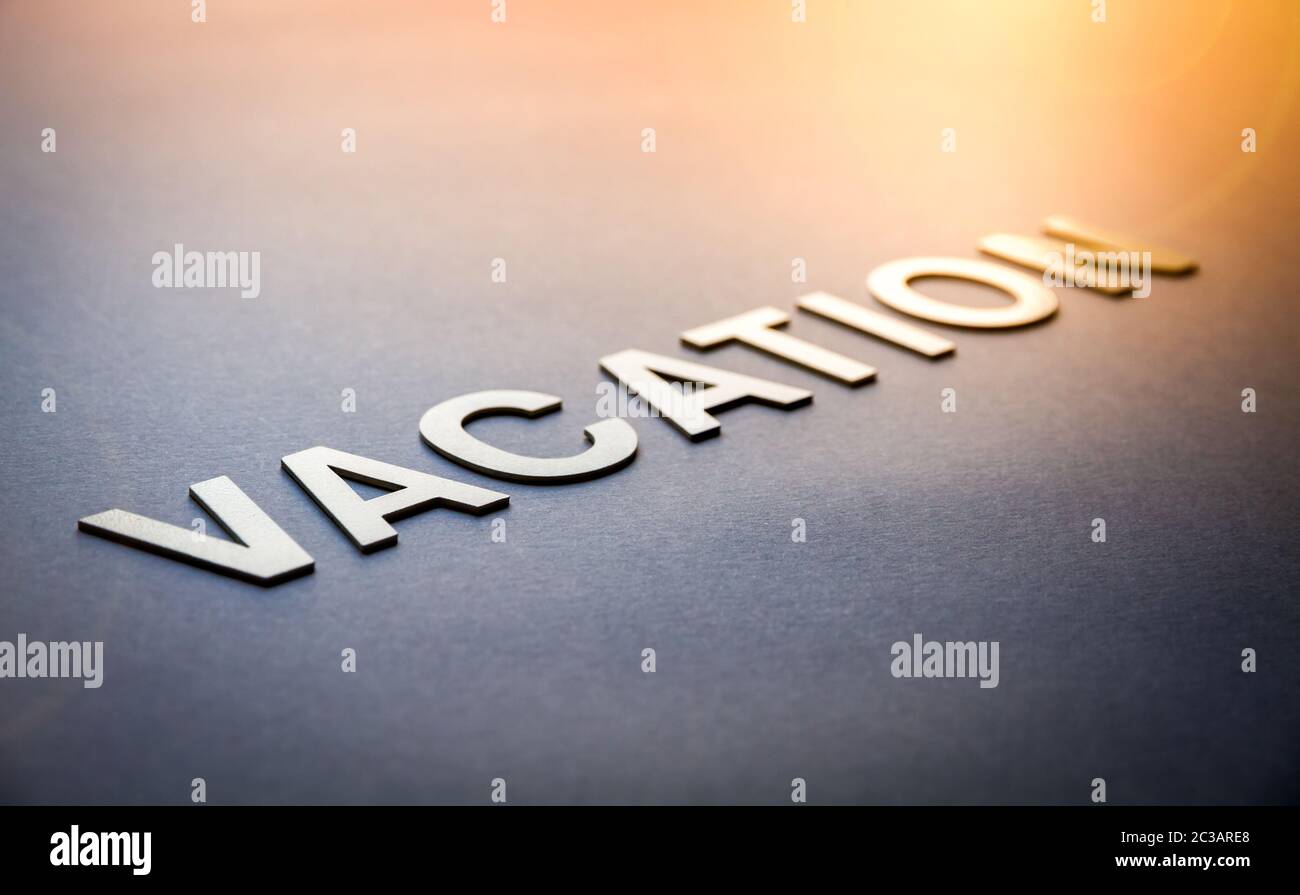 Word vacation written with white solid letters on a board Stock Photo ...
