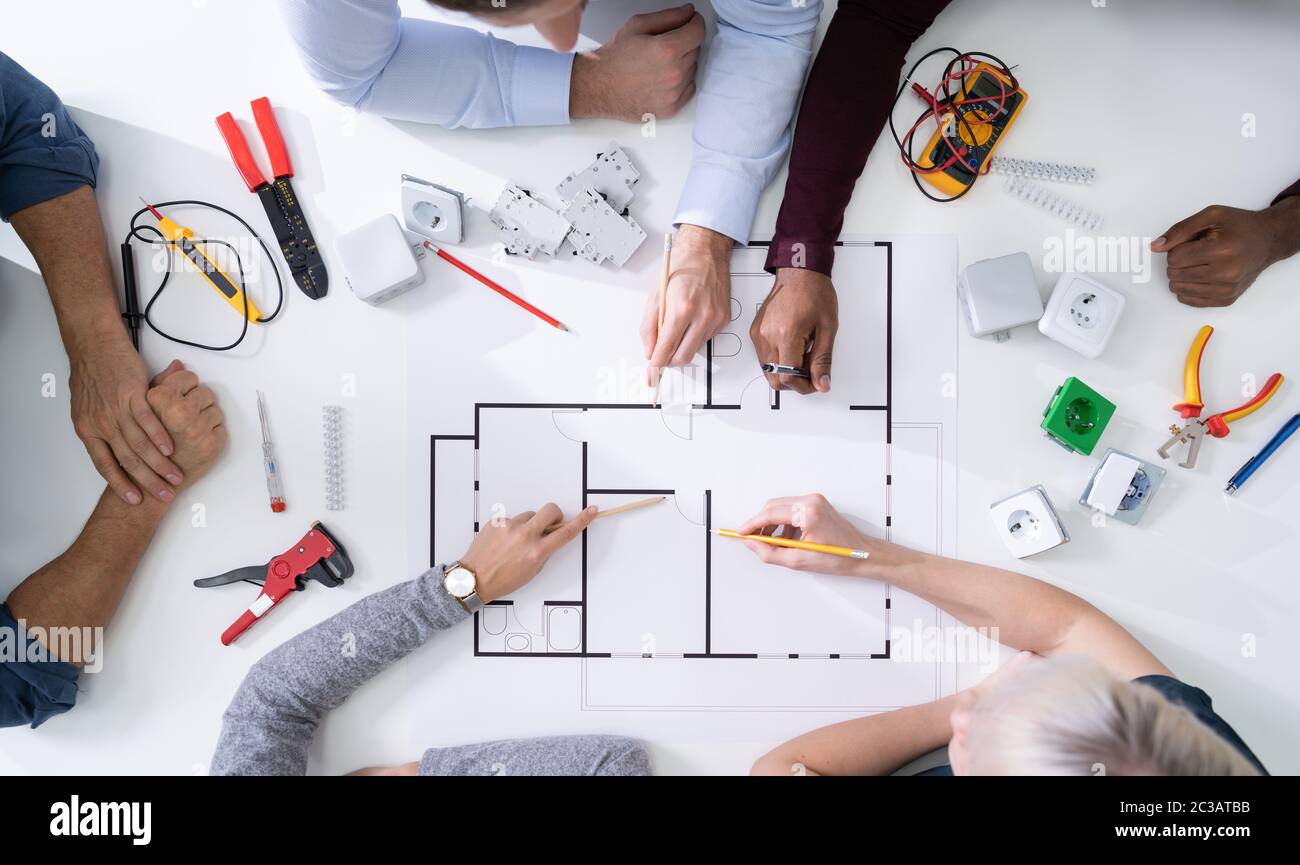 Elevated View Of An Architects Drawing Plan On Blueprint With ...