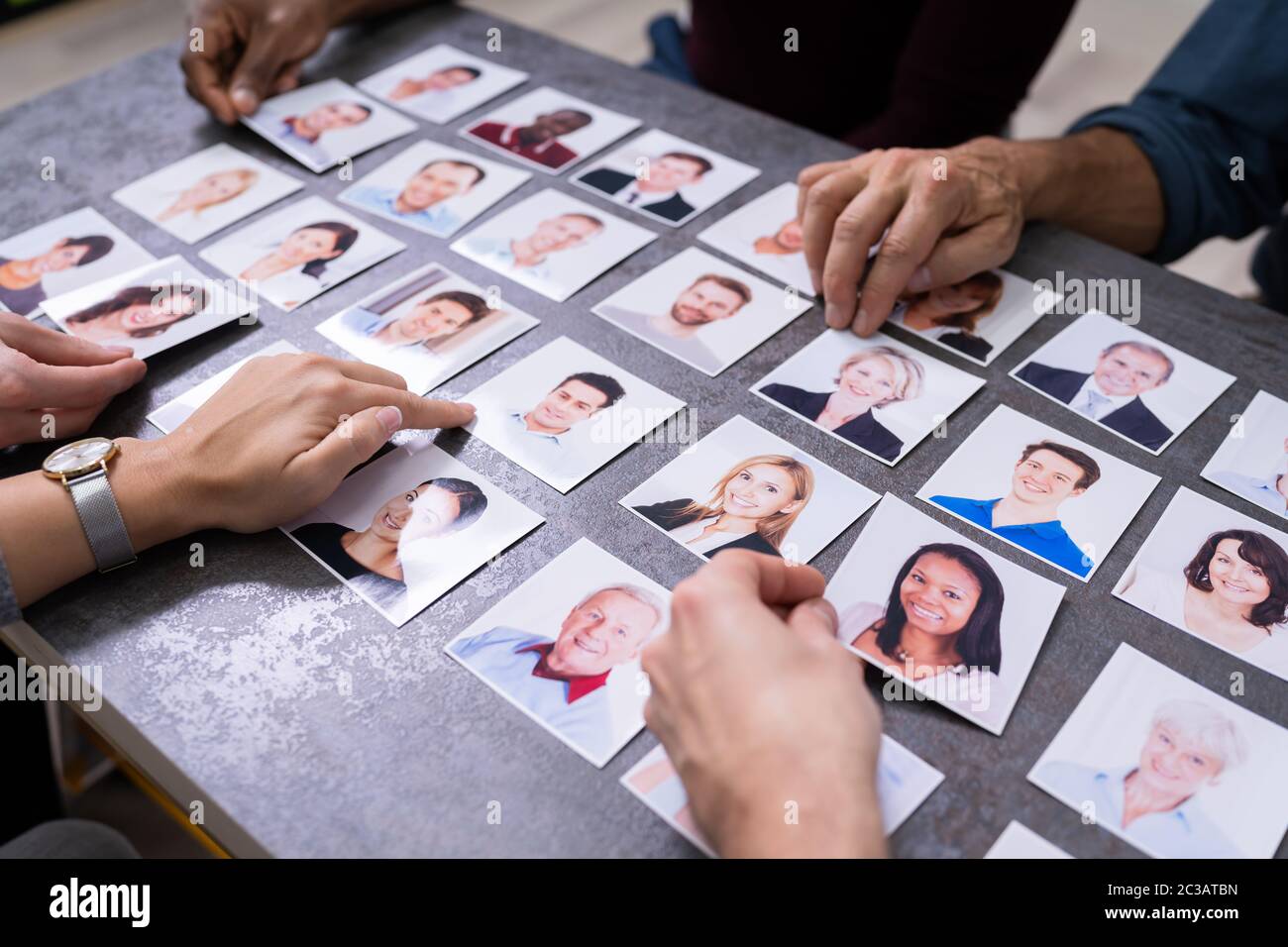 Businesspeople Hand Selecting The Candidate Portrait Photo For Hiring ...