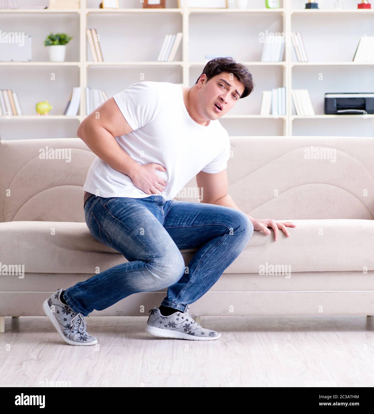 Man suffering from sick stomach and vomiting Stock Photo - Alamy